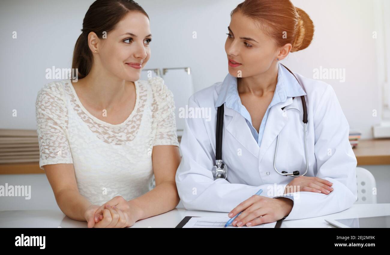 Doctor and patient sitting at the desk. Medicine and health care ...