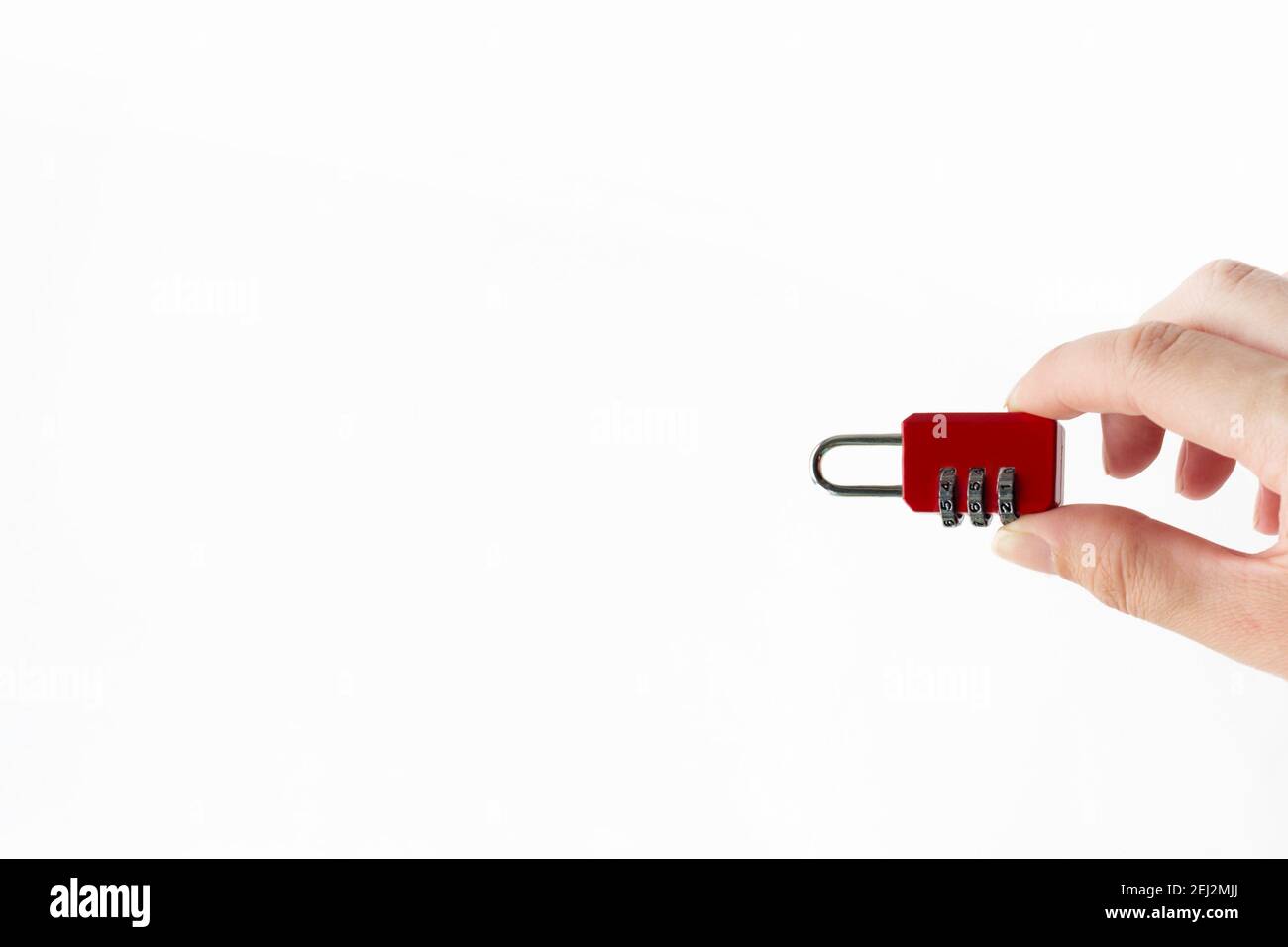 Combination red lock in hand on white background. Security Concept ...