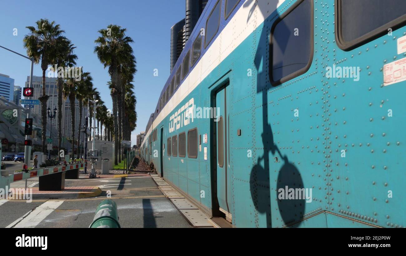 SAN DIEGO, CALIFORNIA USA - 13 FEB 2020: Coaster Commuter and palms ...