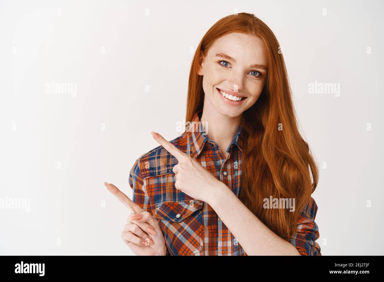 Beautiful female student with pale skin and long natural ginger hair ...