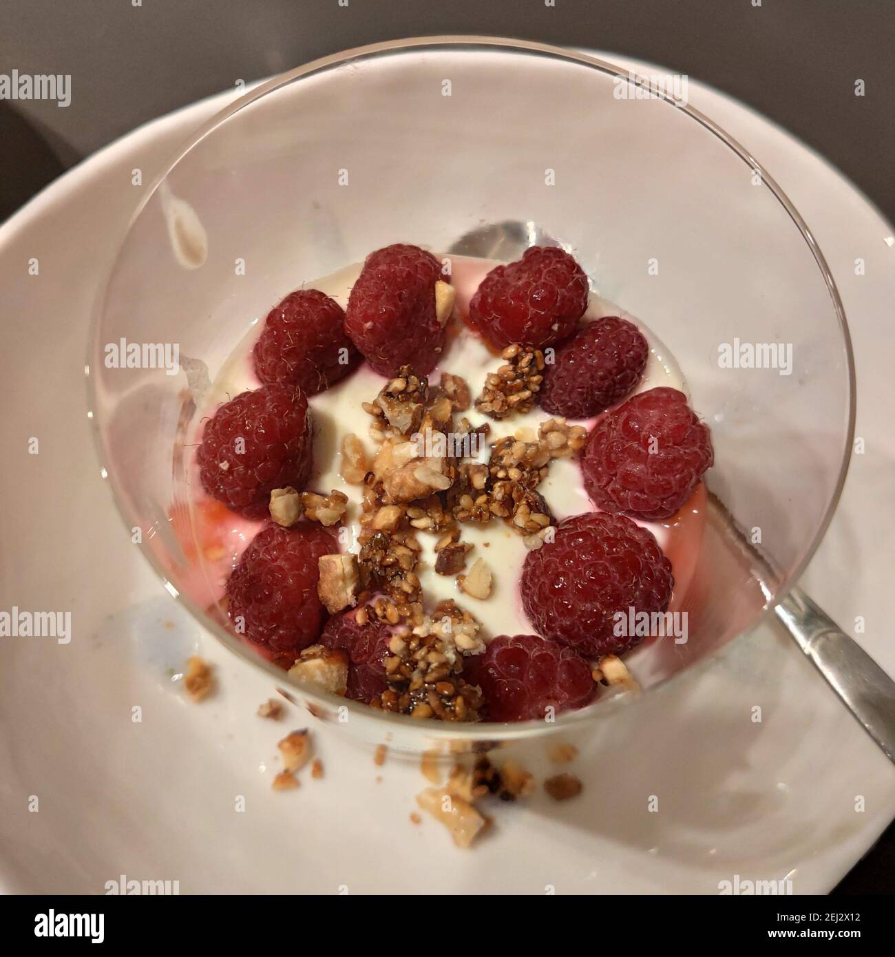 A top view of yogurt with strawberries and walnut in a bowl Stock Photo ...