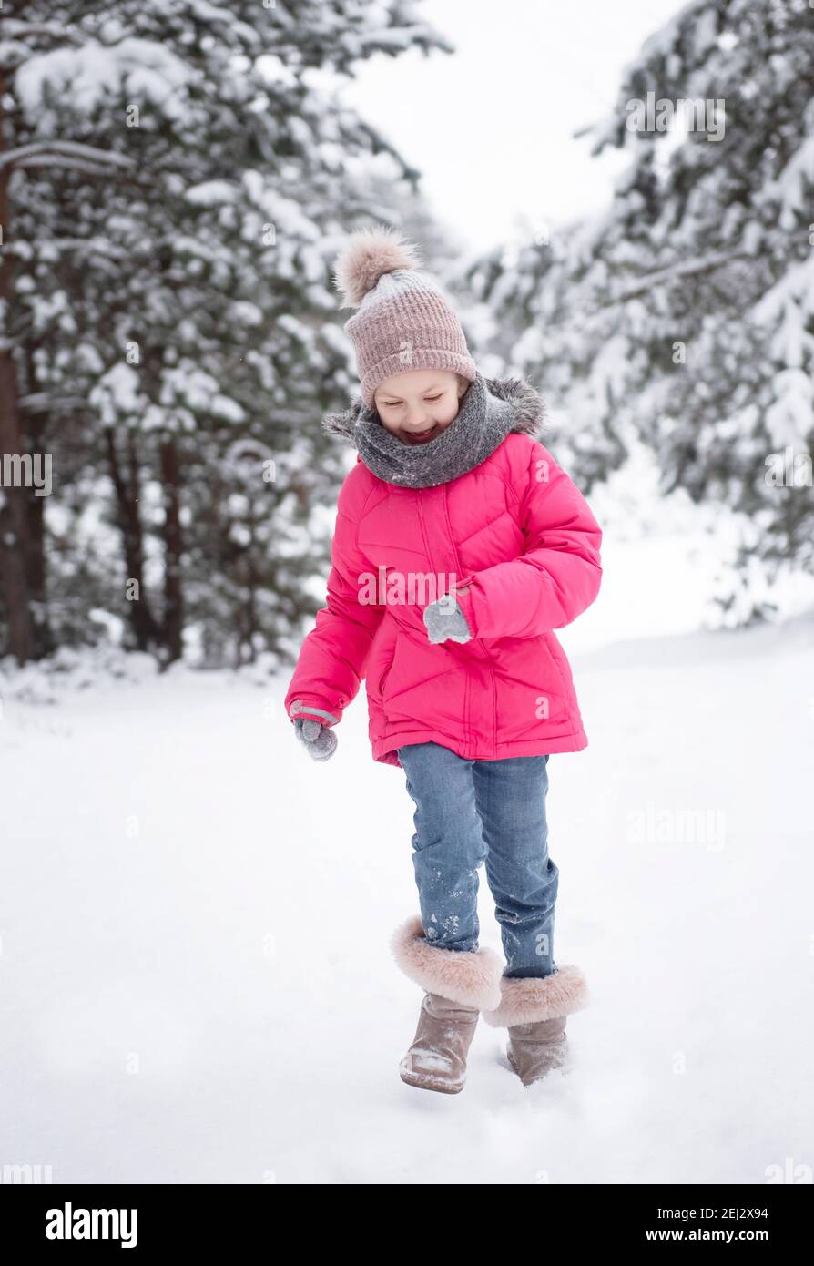 Child in winter. A little girl, playing in the winter outside. A ... Child in winter. A little girl, playing in the winter outside. A ...