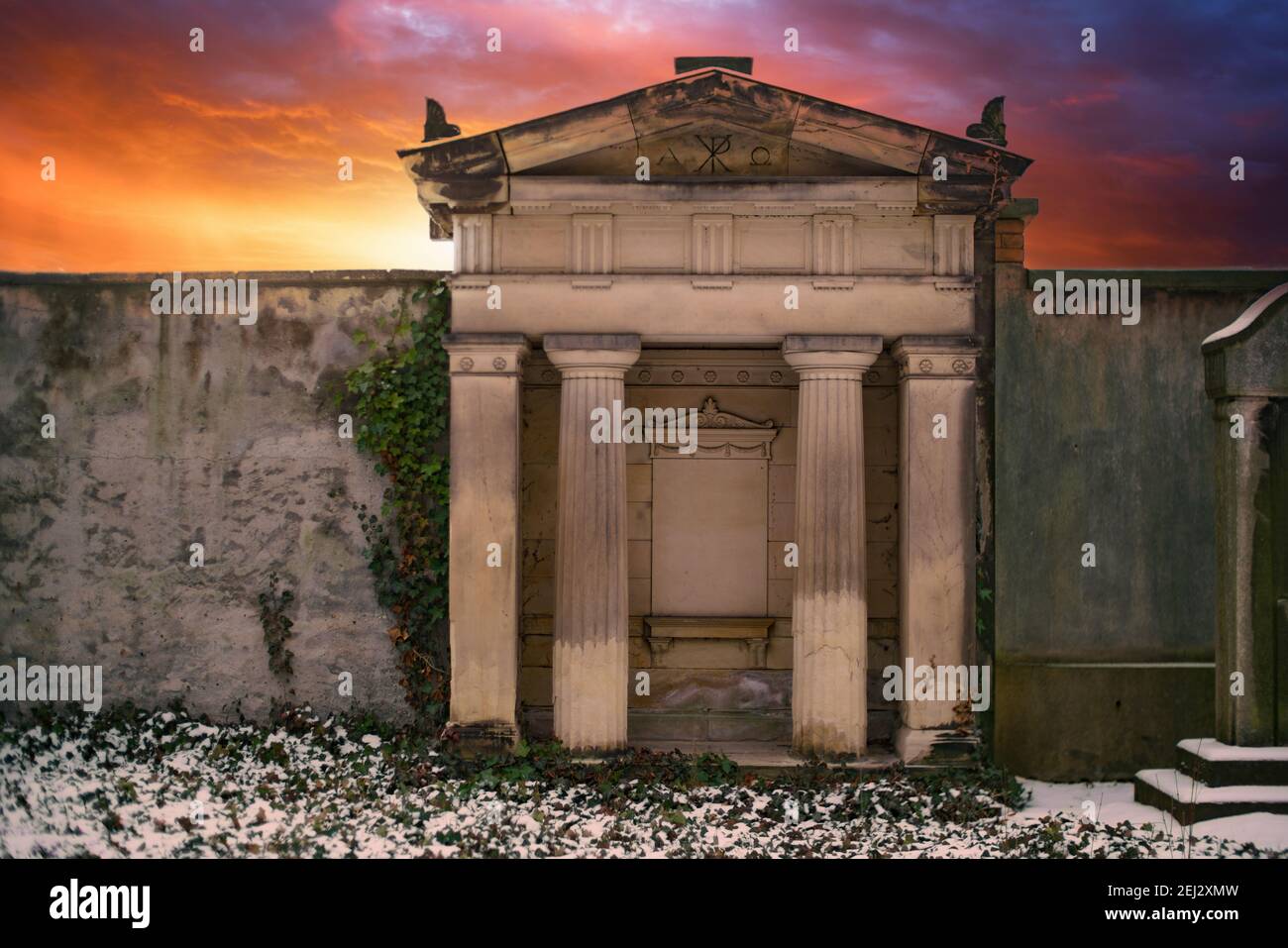 Cemetery crypt and red sky Stock Photo - Alamy