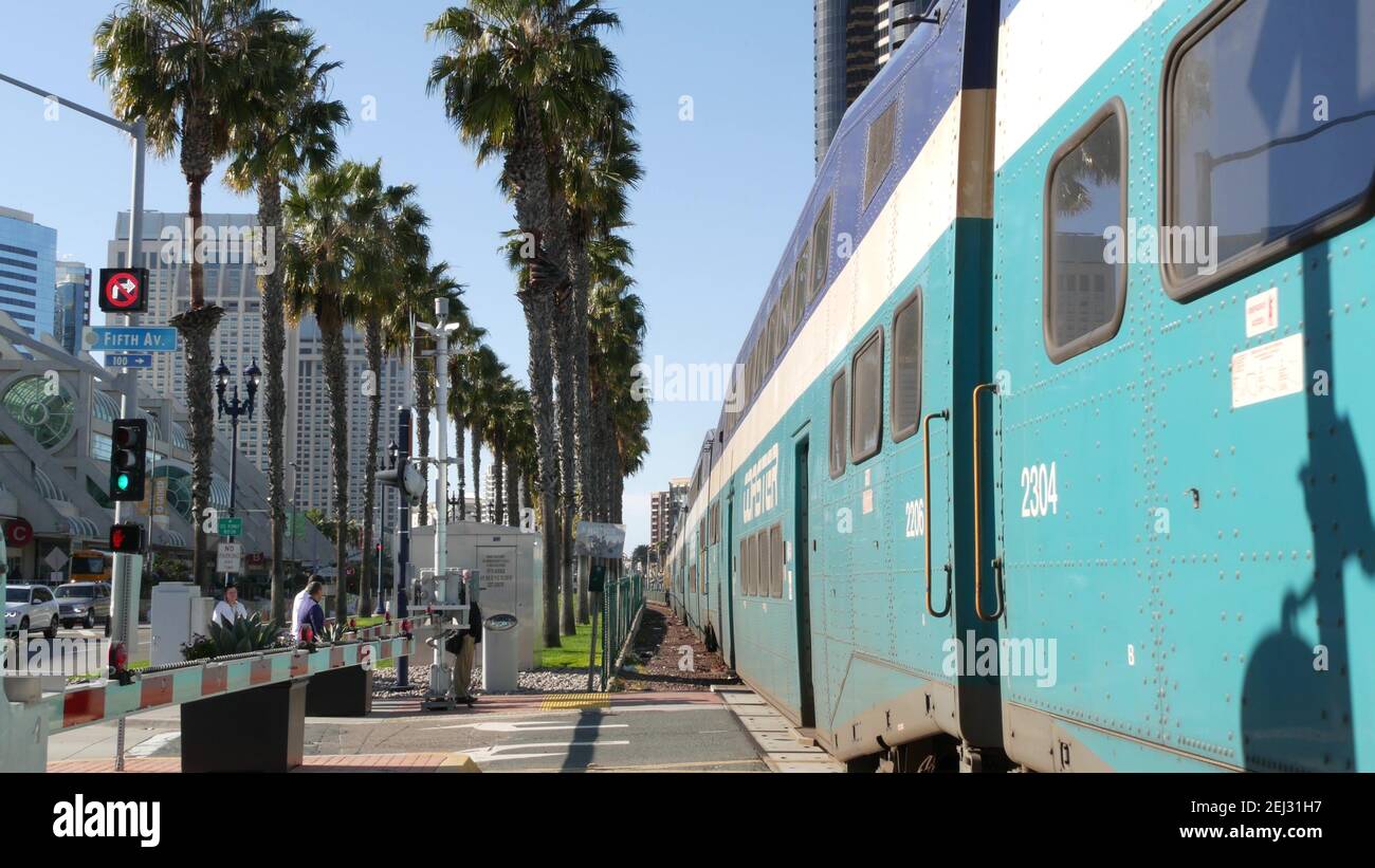 SAN DIEGO, CALIFORNIA USA - 13 FEB 2020: Coaster Commuter and palms ...