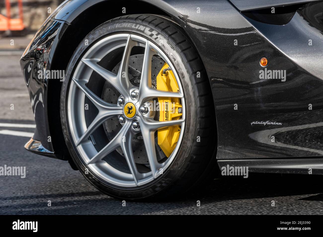 Ferrari front wheel and brake calliper. Black Ferrari F12berlinetta ...