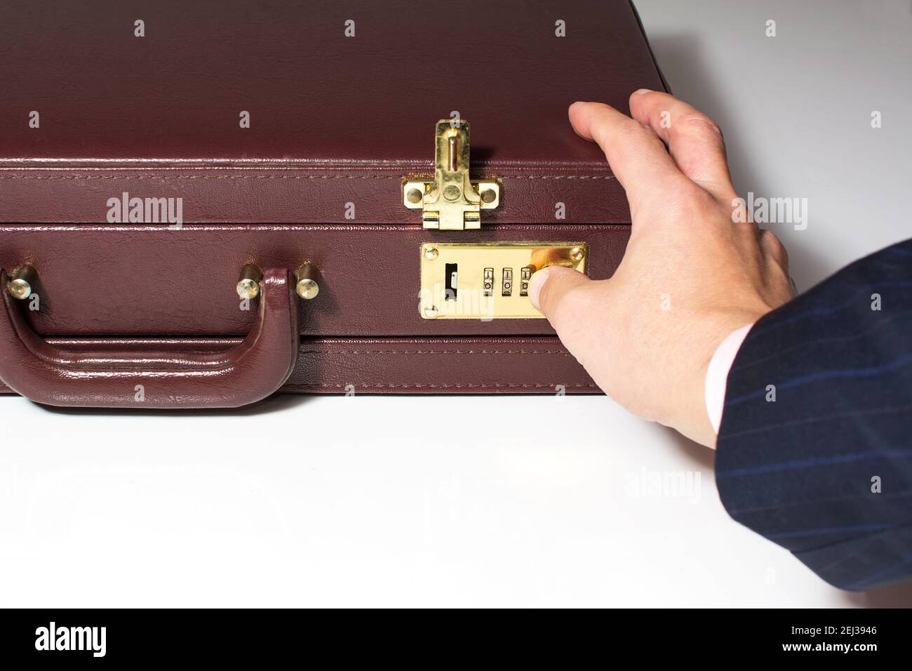 24-hour briefcase with hand that releases the lock Stock Photo - Alamy