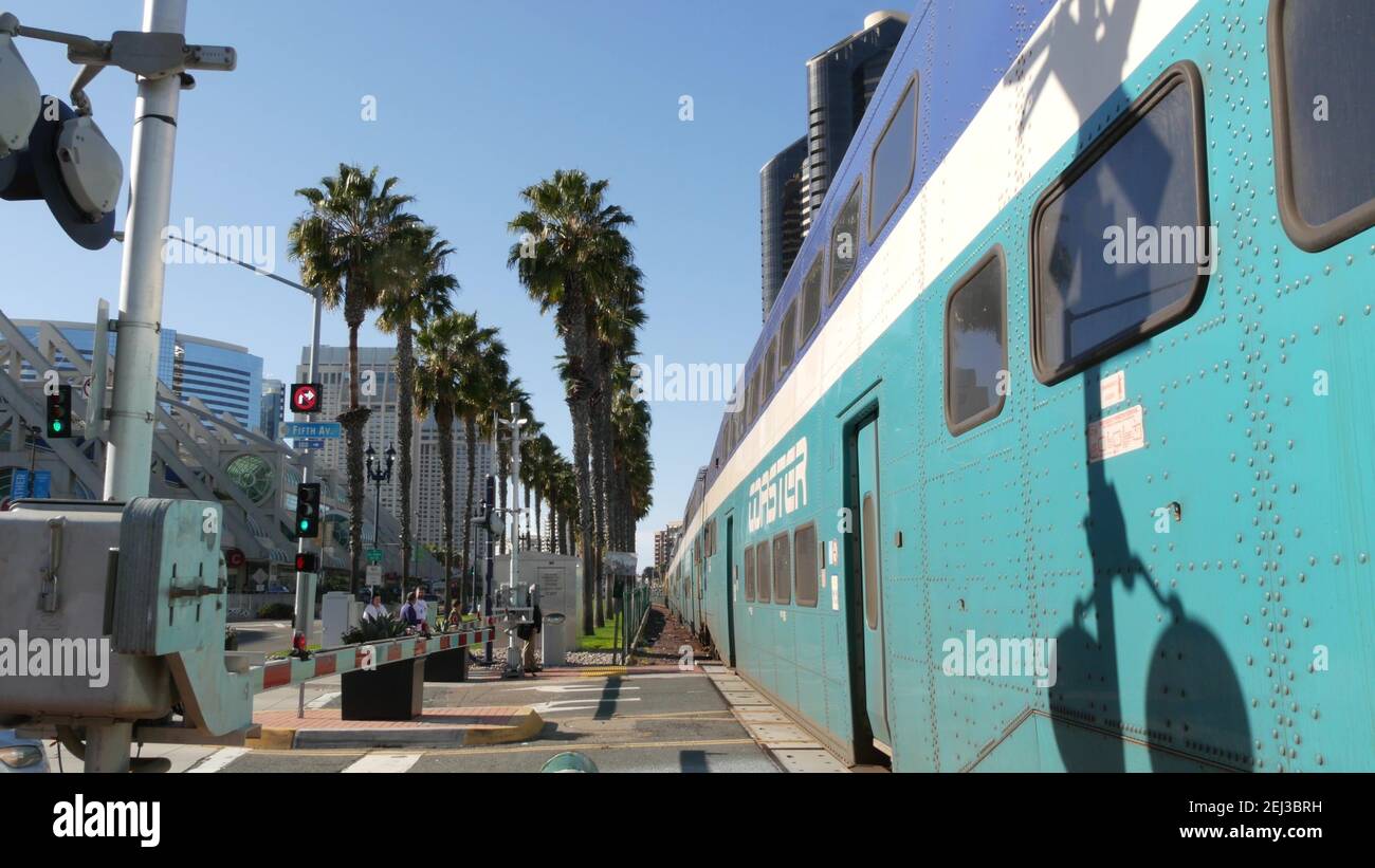 SAN DIEGO, CALIFORNIA USA - 13 FEB 2020: Coaster Commuter and palms ...