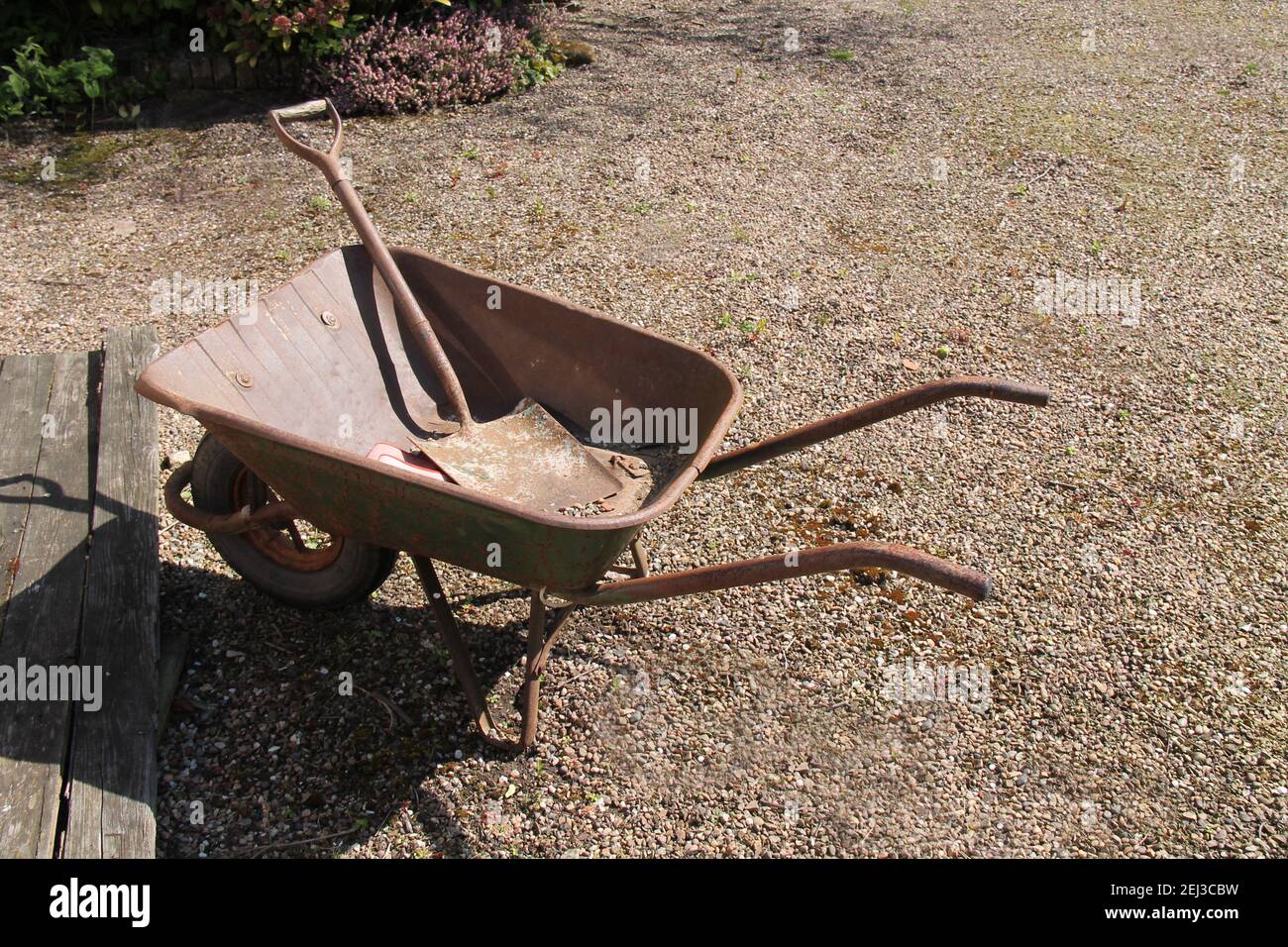 A Garden Wheelbarrow and Shovel Ready for Work Stock Photo - Alamy