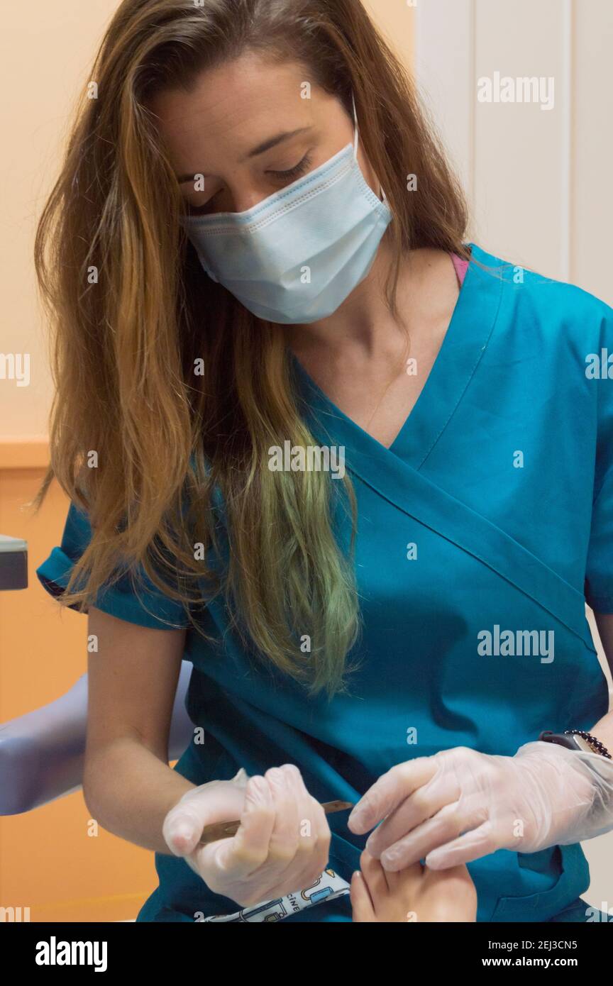 Podiatry doing an examination of the lower limbs and feet Stock Photo ...