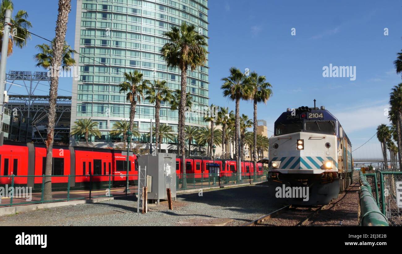 SAN DIEGO, CALIFORNIA USA - 13 FEB 2020: Coaster Commuter and red MTS ...