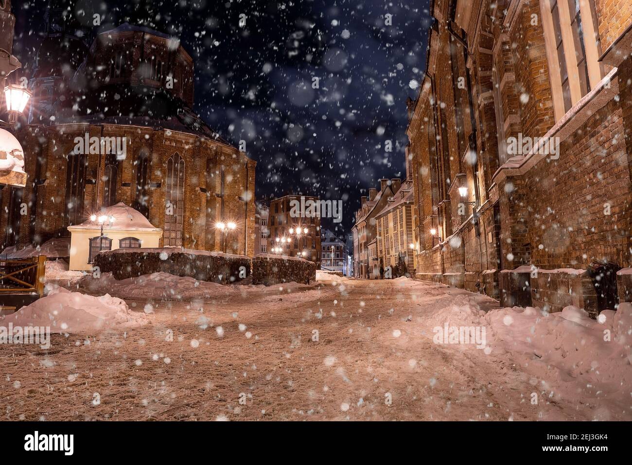 A beautiful view of the old buildings in a town captured while the snow ...