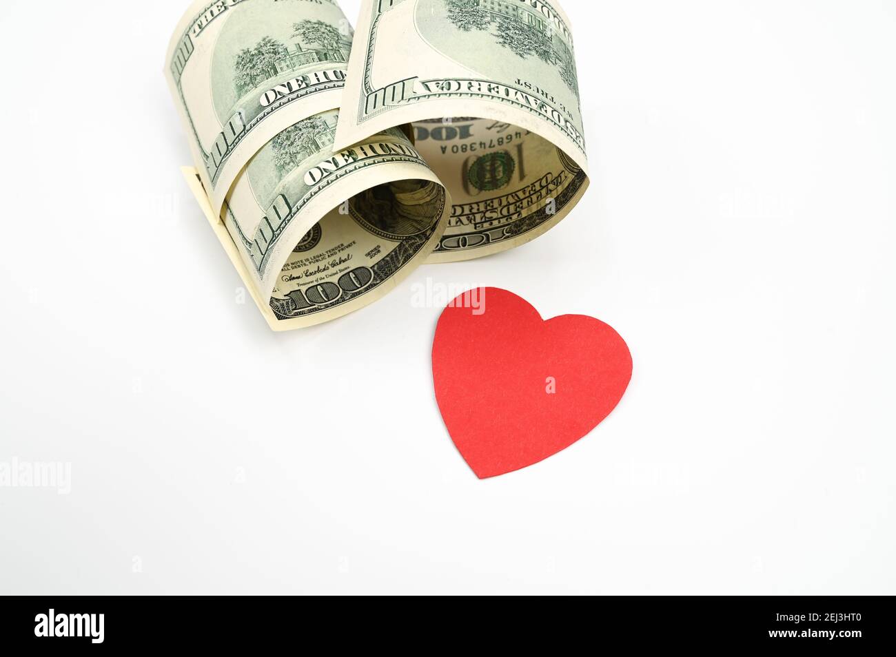 Dollars and heart, on an isolated white background . High quality photo ...