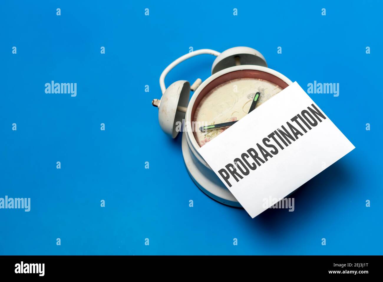 the vintage analog clock with the paper not with word procrastination ...