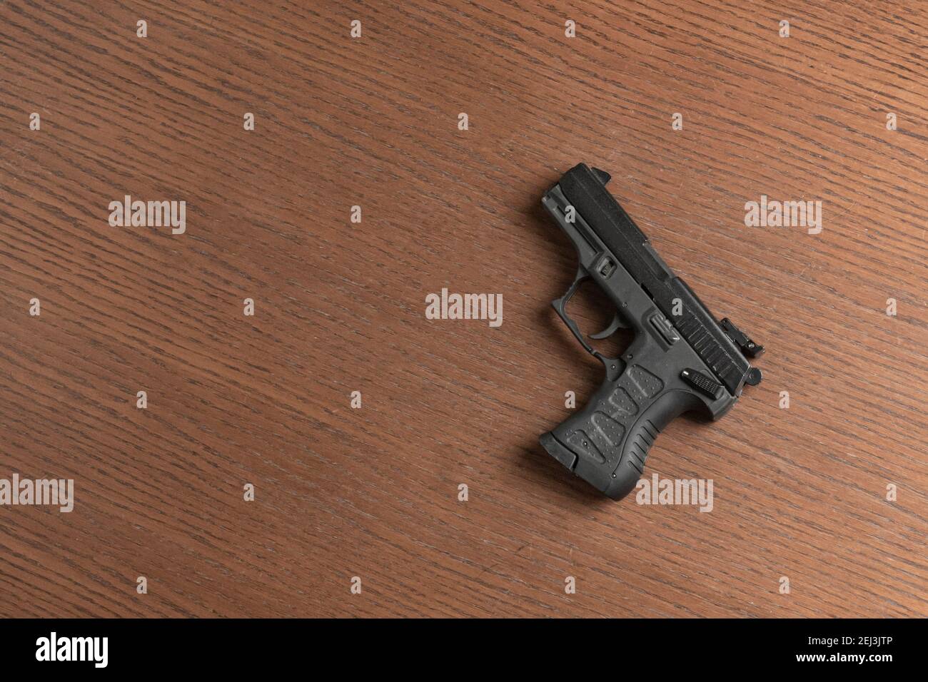 a black 9mm modern fire gun pistol of cop isolated Stock Photo - Alamy