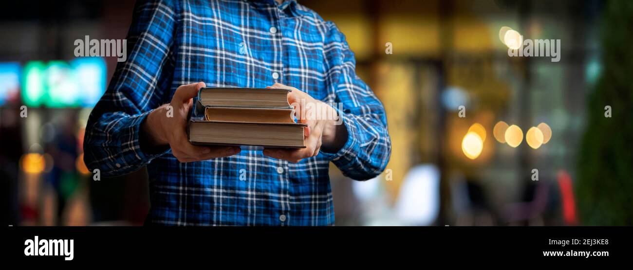 young person holding and giving a book, sharing knowledge and wisdom ...