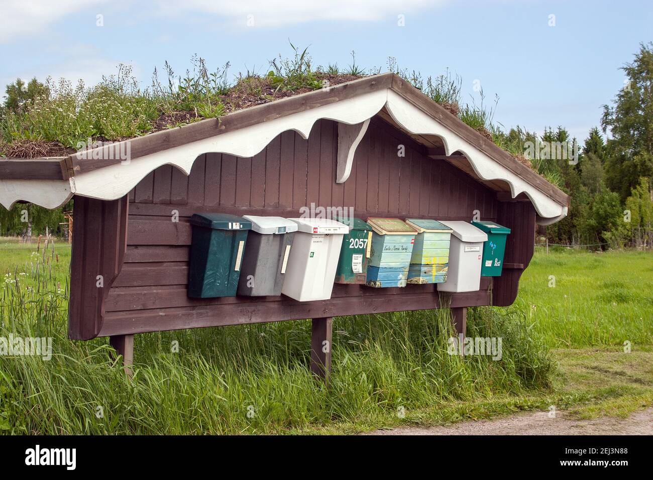 Mailboxes in a row at rural cabin site, Sweden summertime. Photo Bo ...