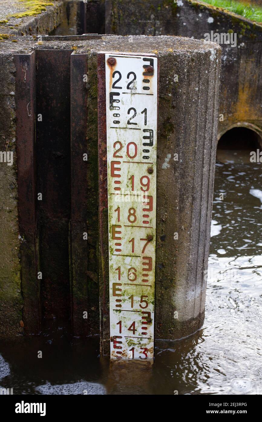 A closeup view of an old water scale, vintage measurement covered in ...