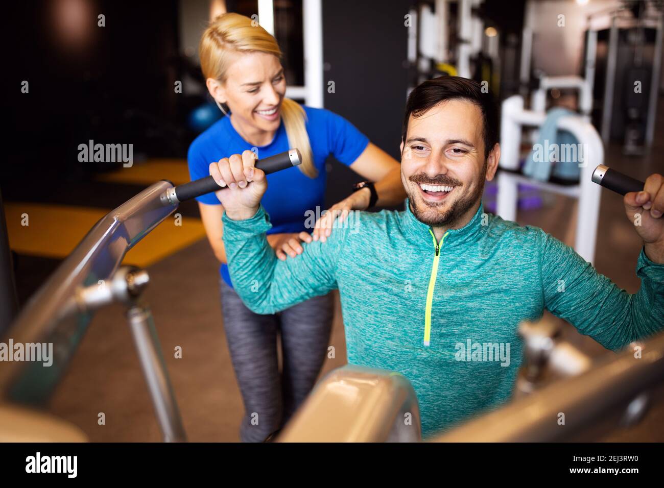 Group of fit people in gym training. Multiracial group of friends ...