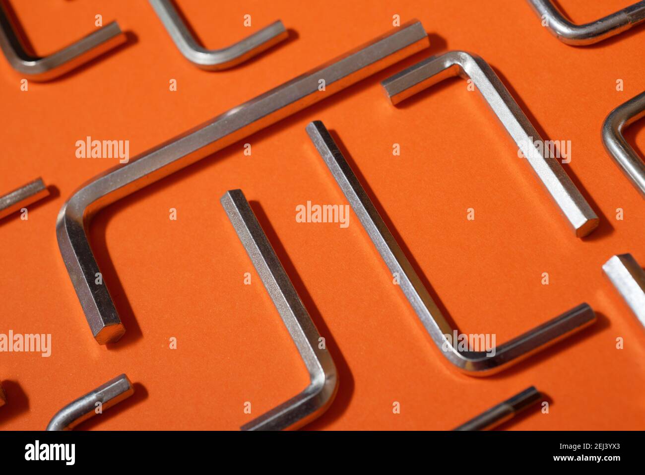 Allen keys on a orange table Stock Photo - Alamy