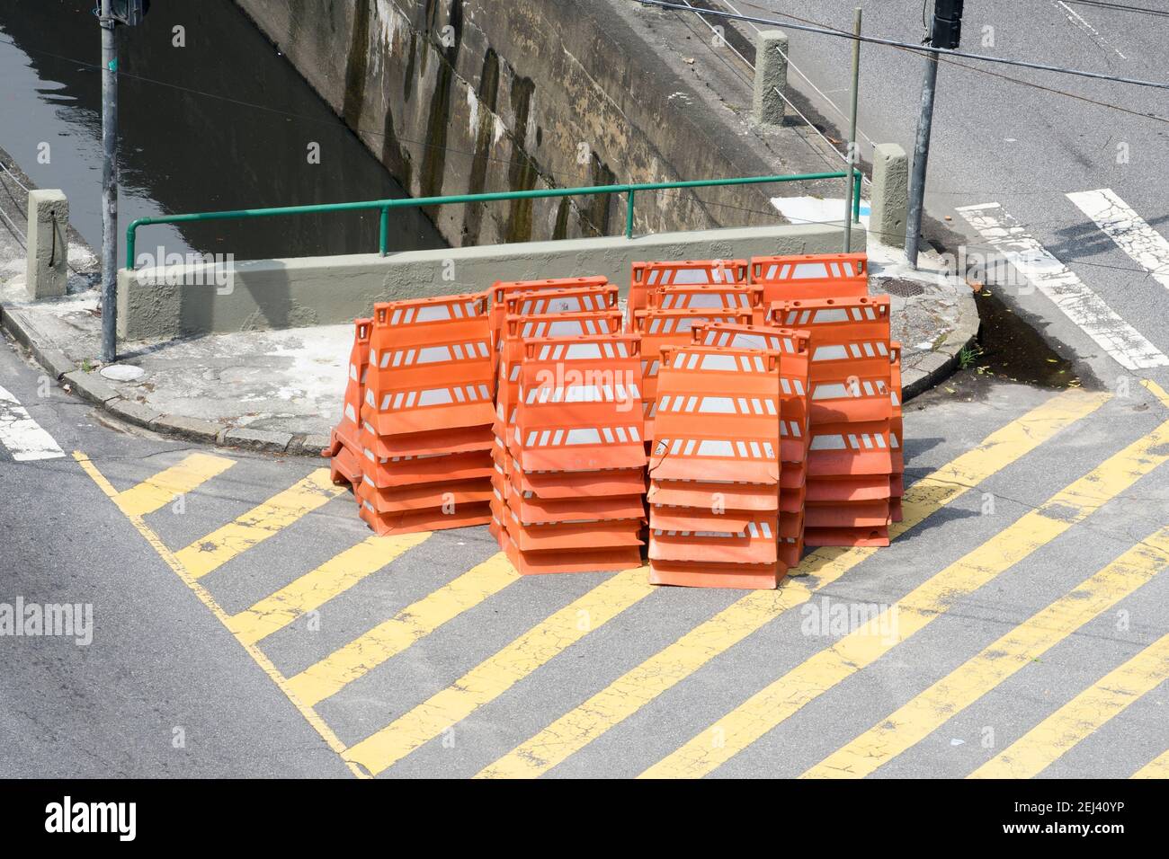 Stack of orange cones for traffic closure on city street Stock Photo ...