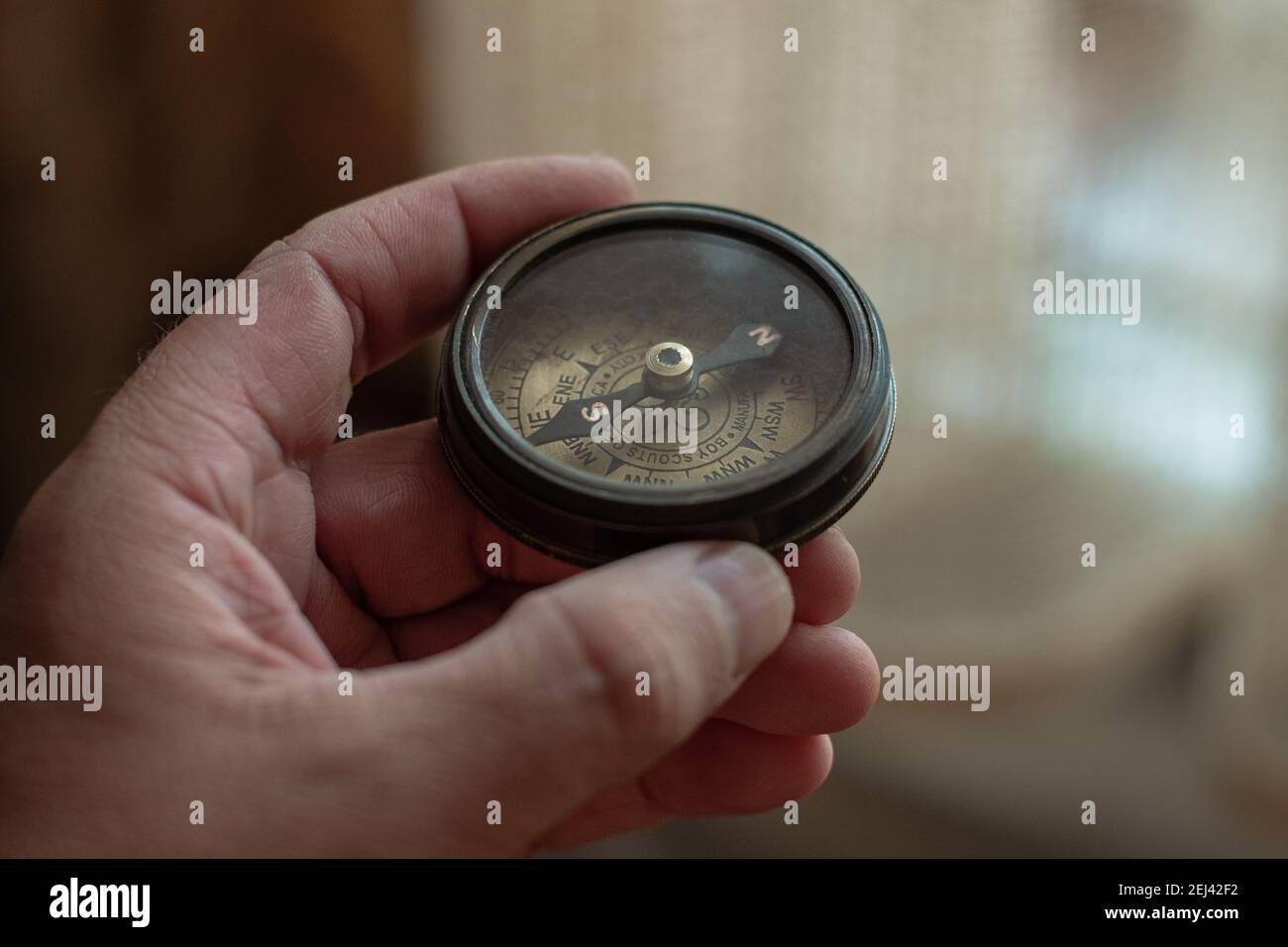 Person holding compass hi-res stock photography and images - Alamy