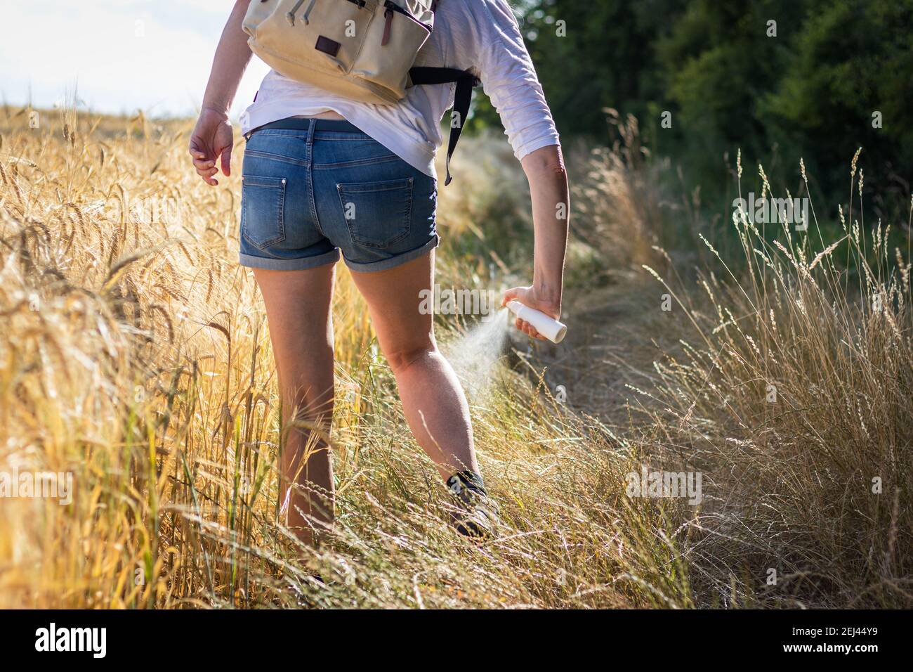 Woman tourist spraying insect hi-res stock photography and images - Alamy