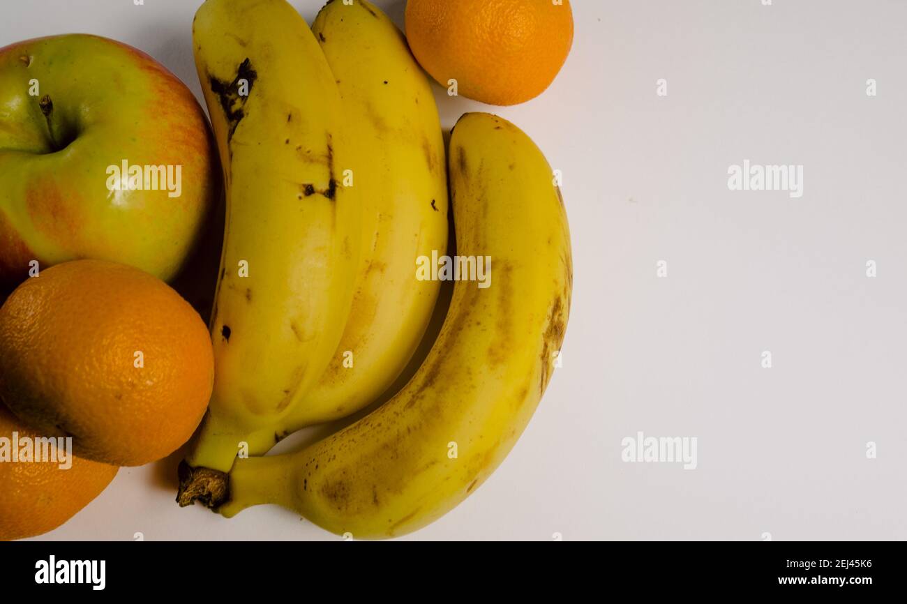 A top view closeup of fresh and healthy seasonal fruits like apples ...