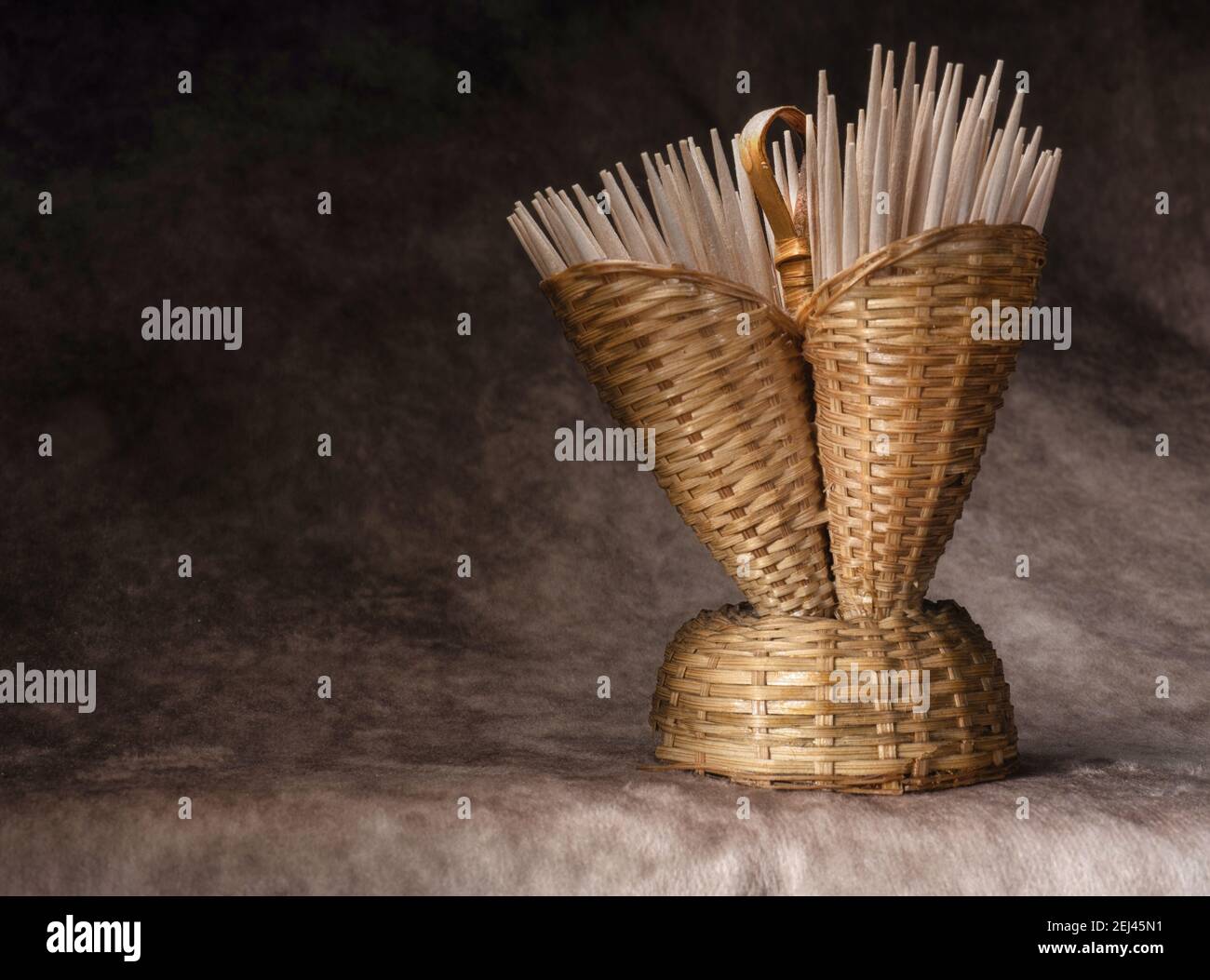 A Wooden toothpick container scene on a Fine Art background. Wicker ...