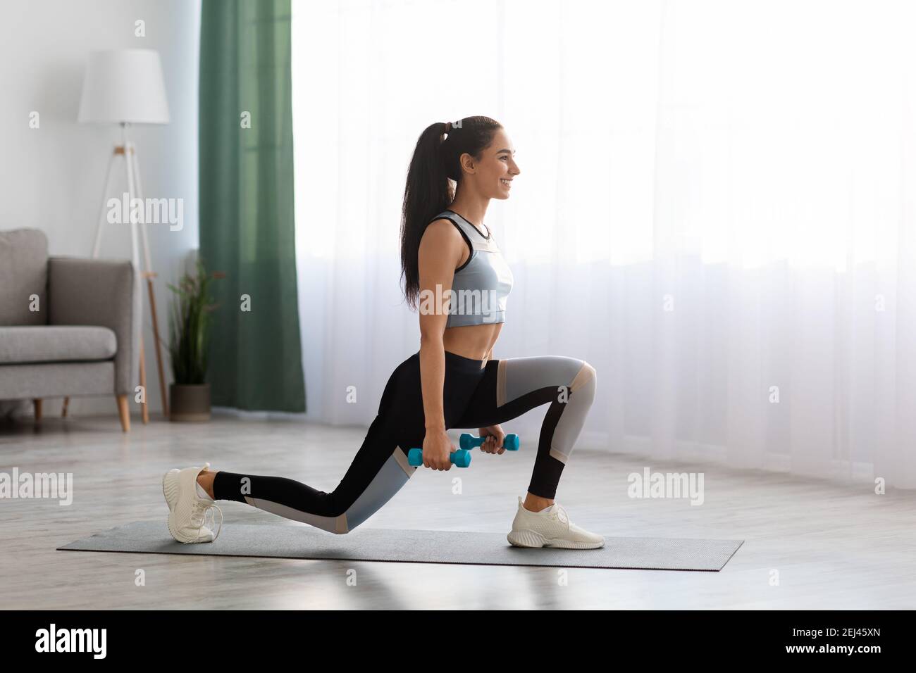 Woman lunges home hi-res stock photography and images - Alamy