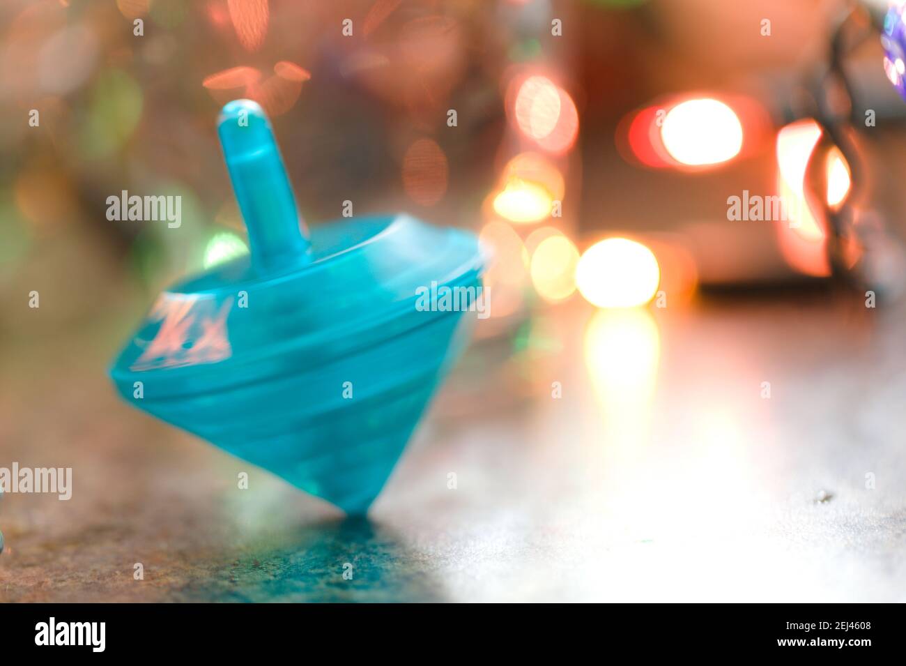 Energy of Motion - Close-up of a blue spinning top in motion Stock ...