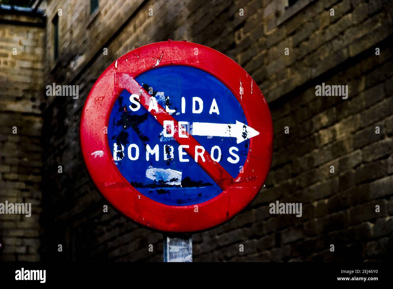 A sign in Spanish "Salida de Bomberos" at the fire station; translation ...