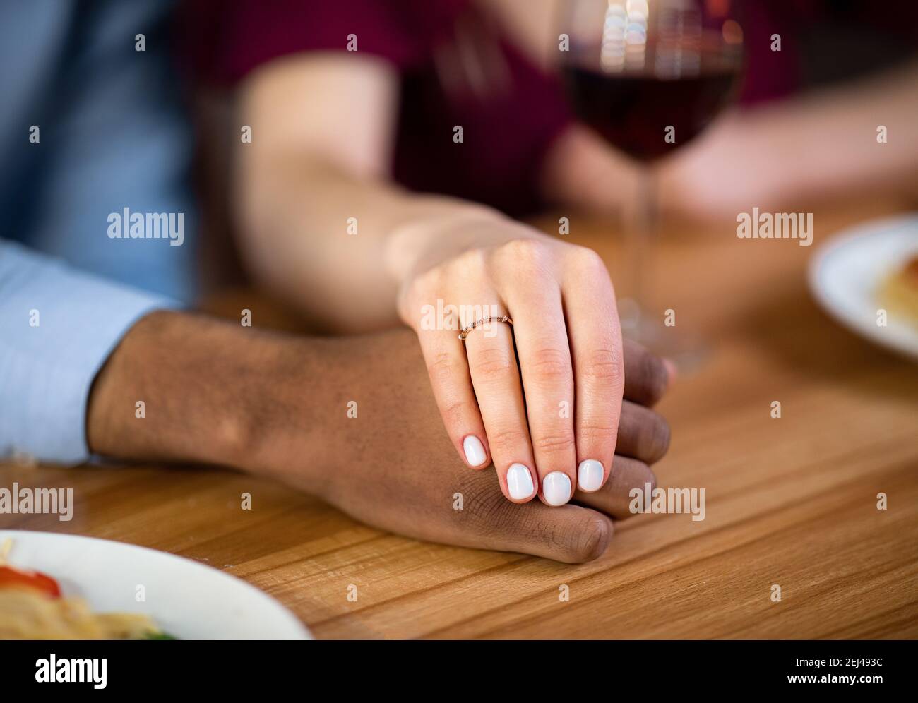 She Said Yes. Female Hand With Engagement Ring Holding Black Boyfriend ...