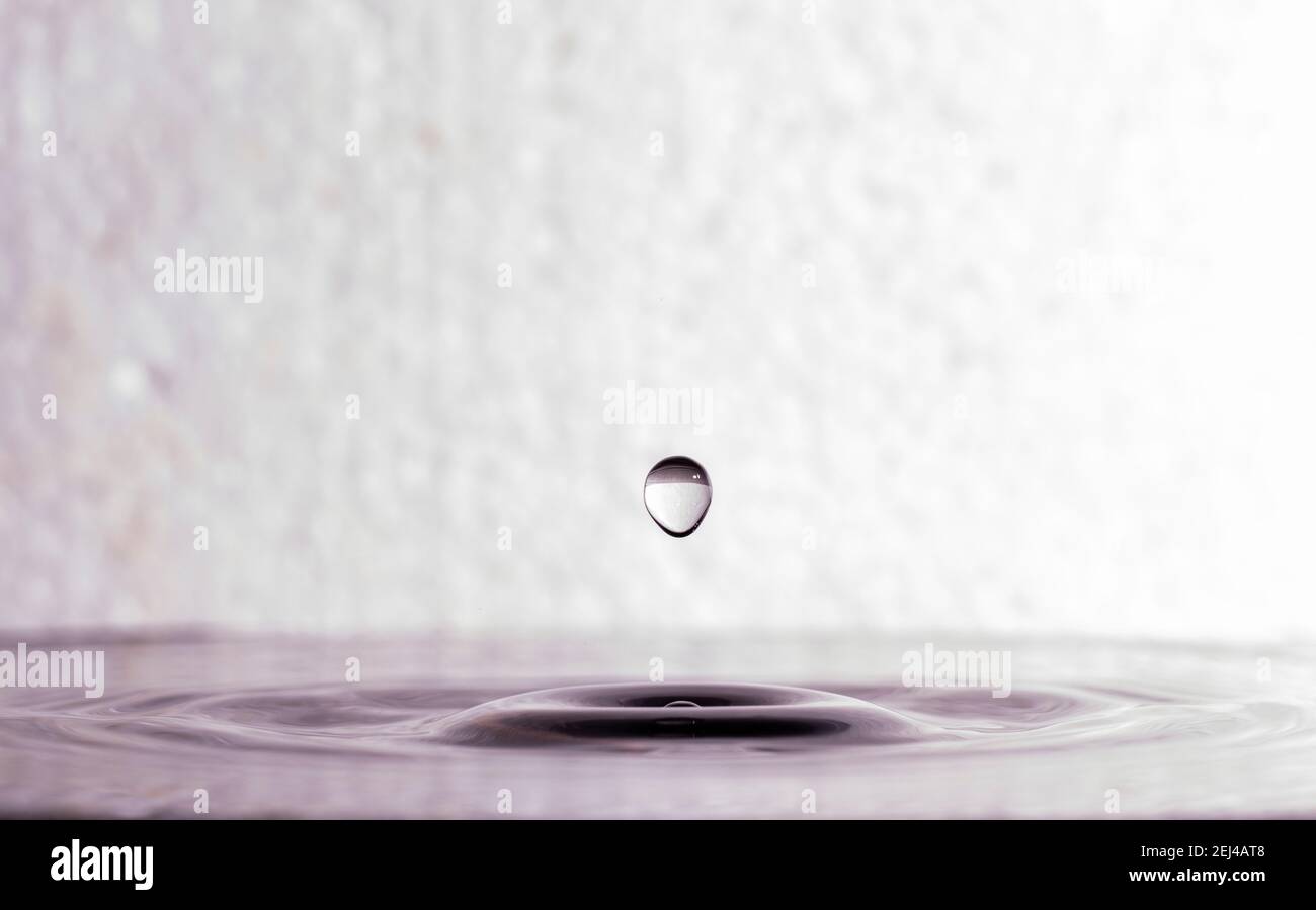 form of water droplets after falling on rippled water surface Stock ...
