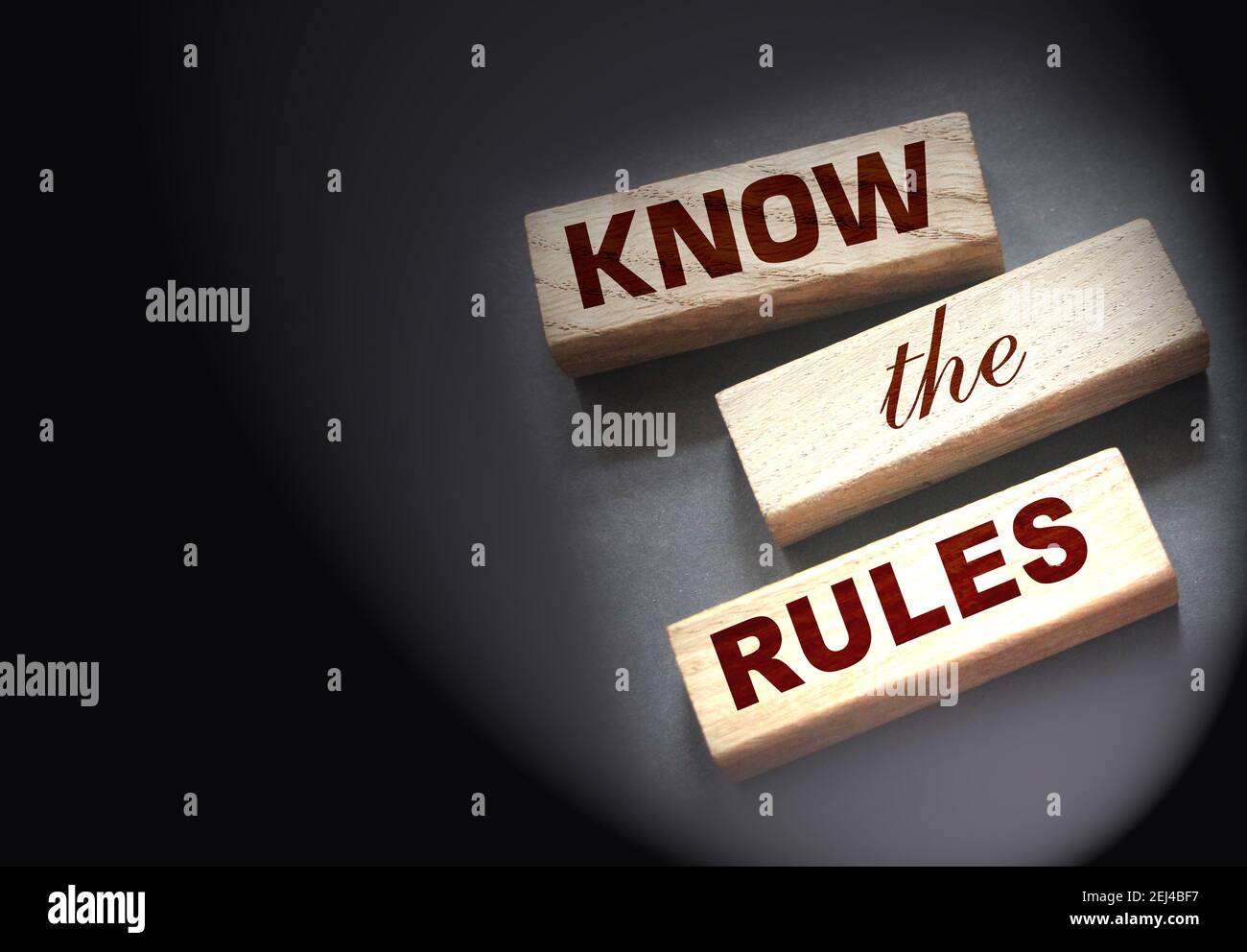Know the rules word on wooden blocks isolated on dark grey background ...