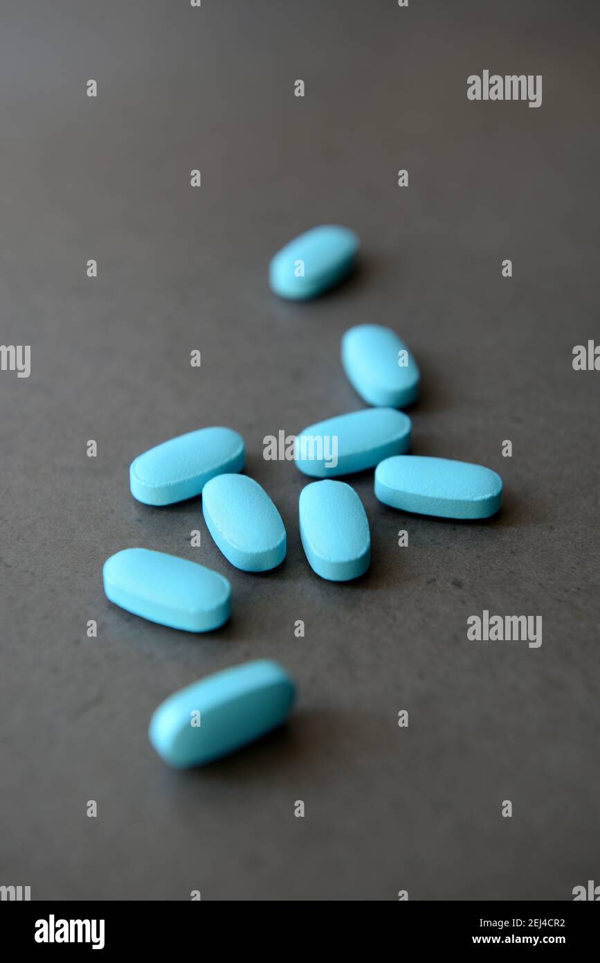 Pharmaceutical medicine pills over dark background Stock Photo - Alamy