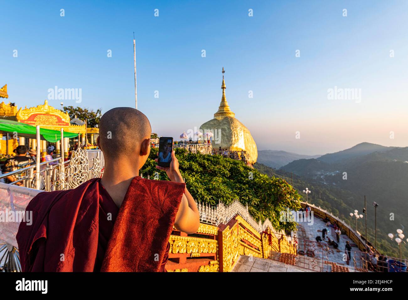 Monk photographing the Kyaiktiyo Pagoda, golden rock, Mon state ...