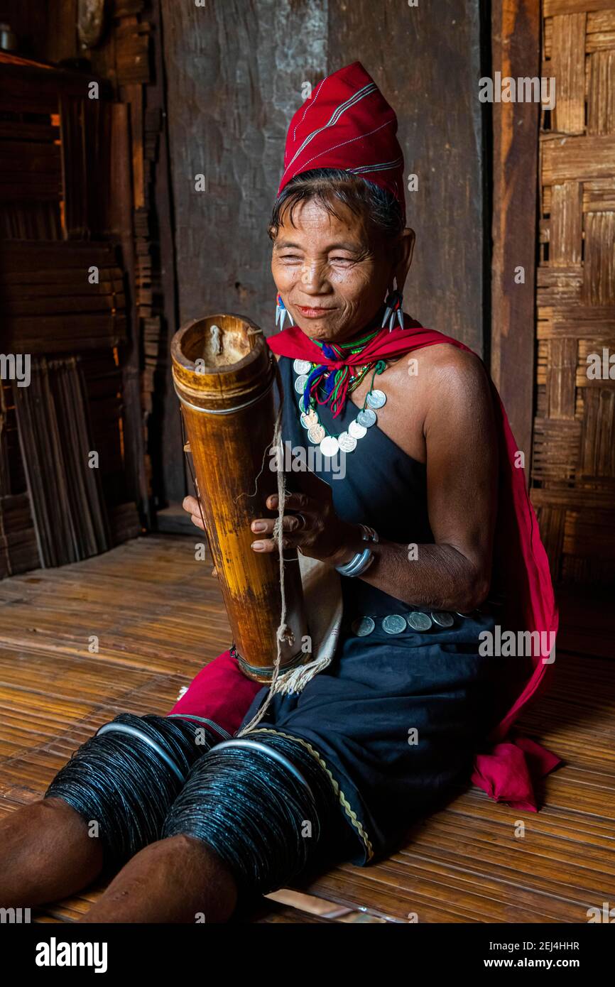 Old Kayah woman playing local instrument, Kayah village, Loikaw area ...