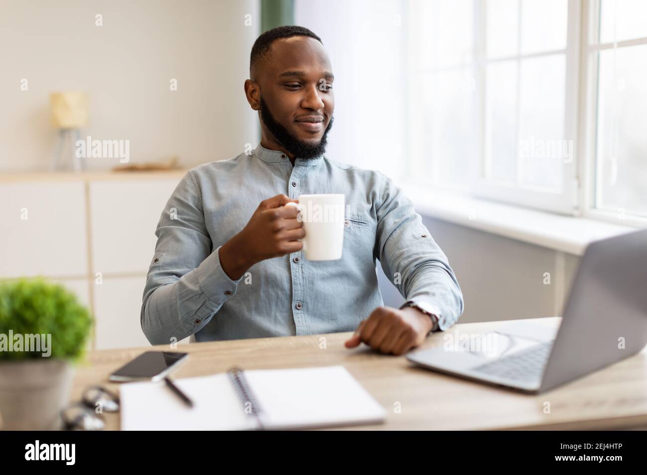Successful Black Businessman Having Coffee Relaxing Sitting In Modern ...