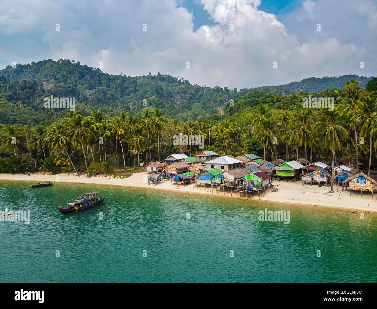 Aerial of a Moken, sea gypsy village on a white sand beach, Mergui or ...