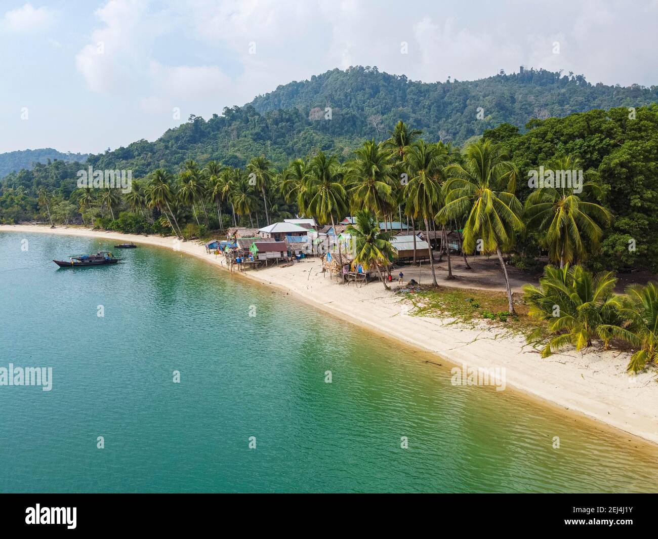 Aerial of a Moken, sea gypsy village on a white sand beach, Mergui or ...