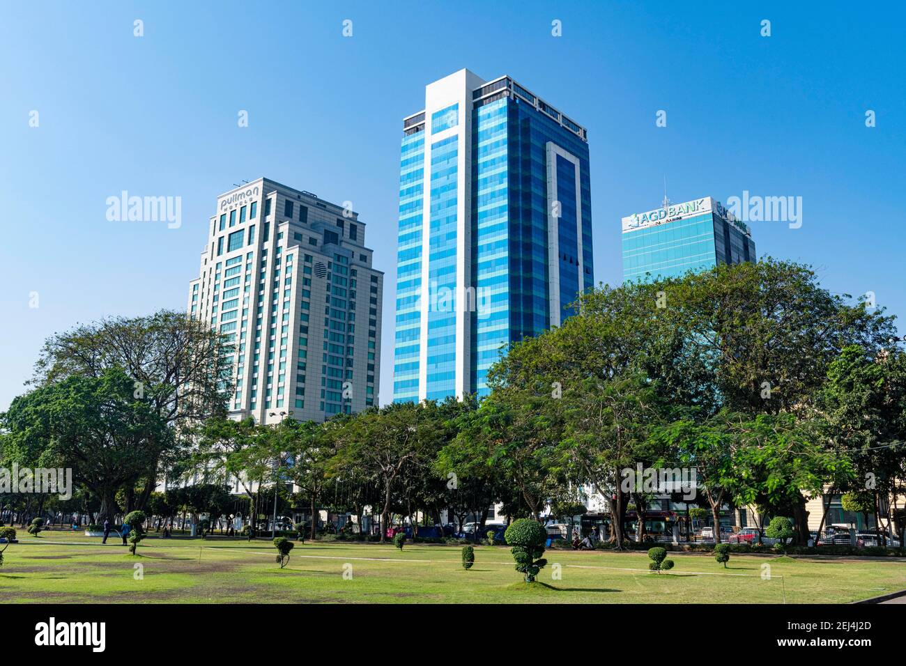 High rise buildings behind the Mahabandoola garden, Yangon, Myanmar ...