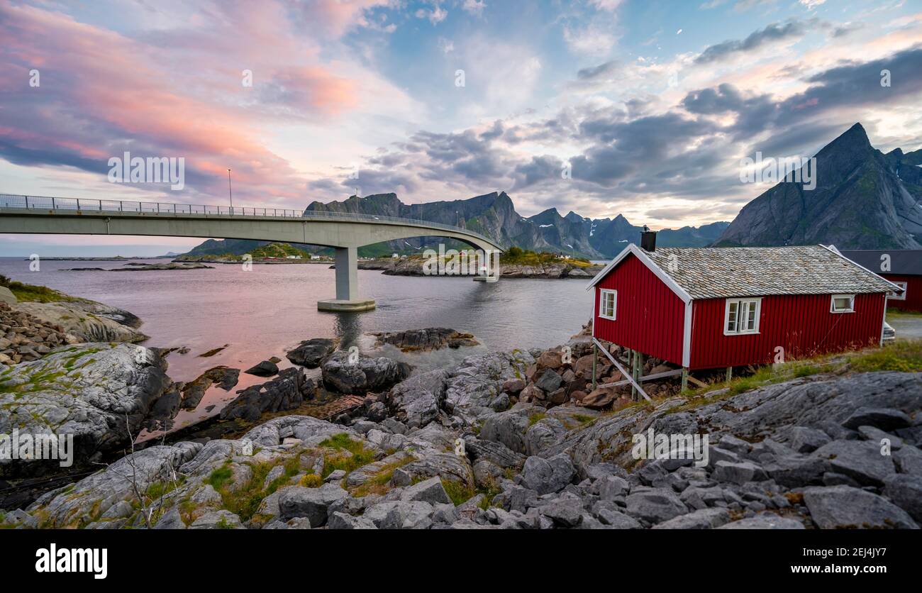 Traditional red stilt houses, typical fishing hut with bridge, Reine ...