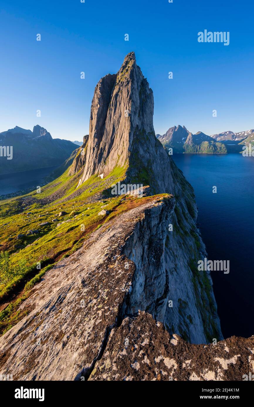 Morning atmosphere, steep mountain Segla, fjord Mefjorden with ...