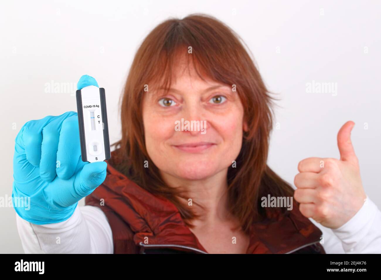 Covid 19 PCR rapid test, Corona, woman is delighted because of negative ...