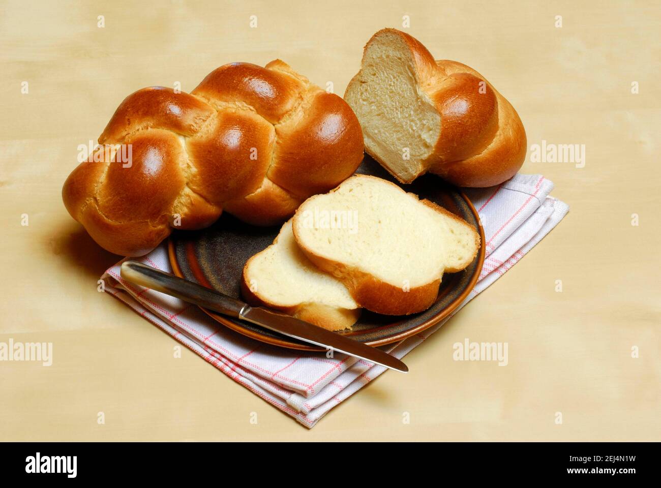 Butter plait on plate, baked goods, Swiss white bread, bread Stock ...