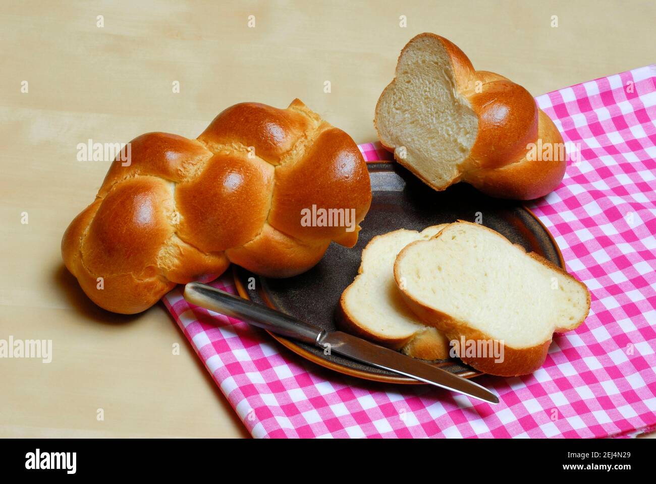 Butter plait on plate, baked goods, Swiss white bread, bread Stock ...