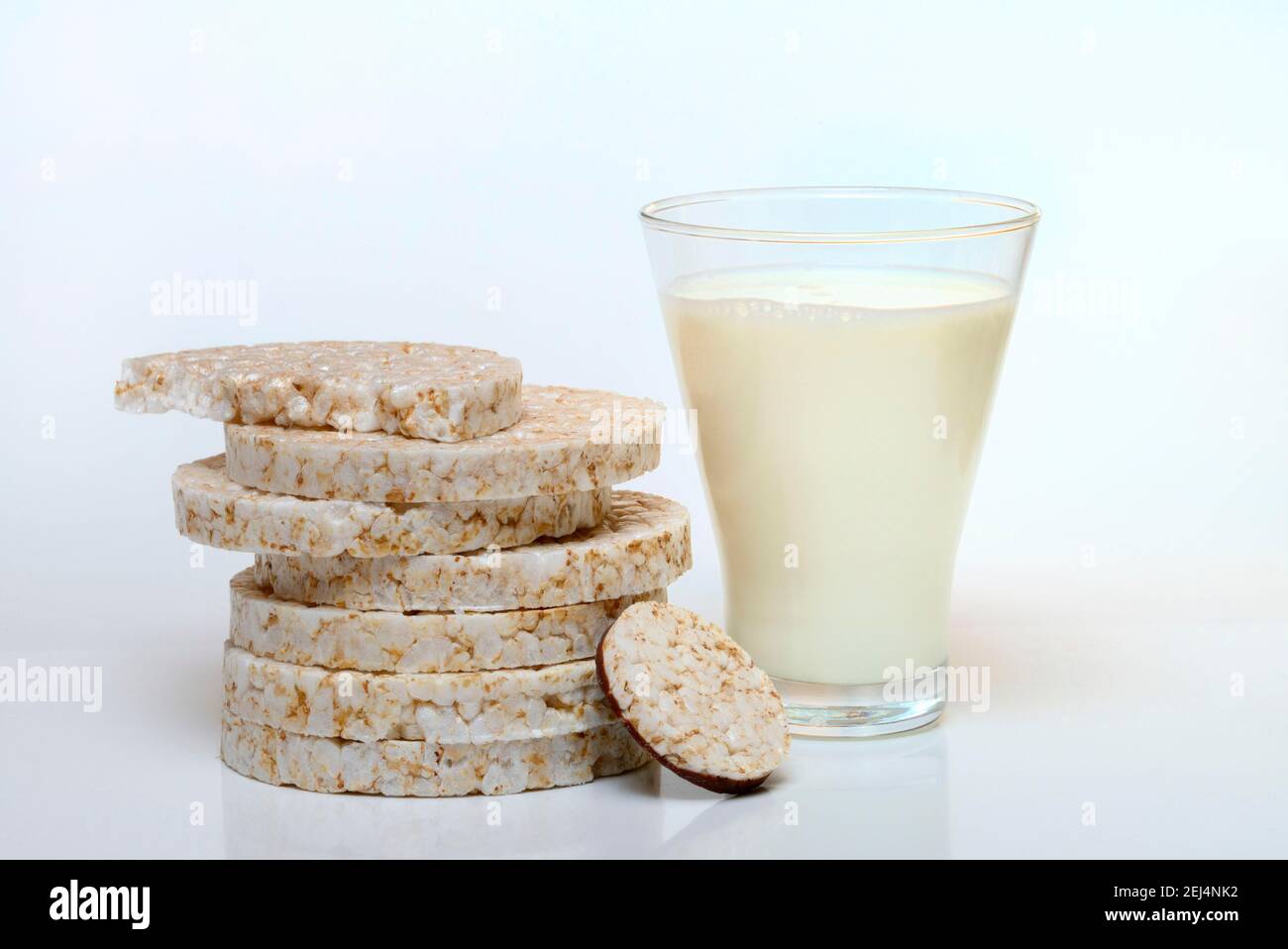 Stacked rice cakes, chocolate coated rice cakes, glass of milk, rice ...