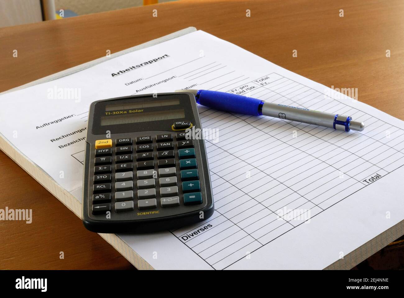 Pocket calculator and ballpoint pen on work protocol, work report Stock ...