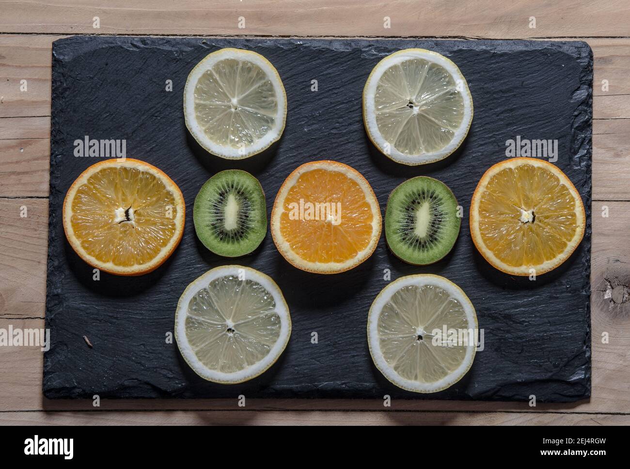 Tropical Fruits Scattered On Concrete Surface Stock Photo - Alamy