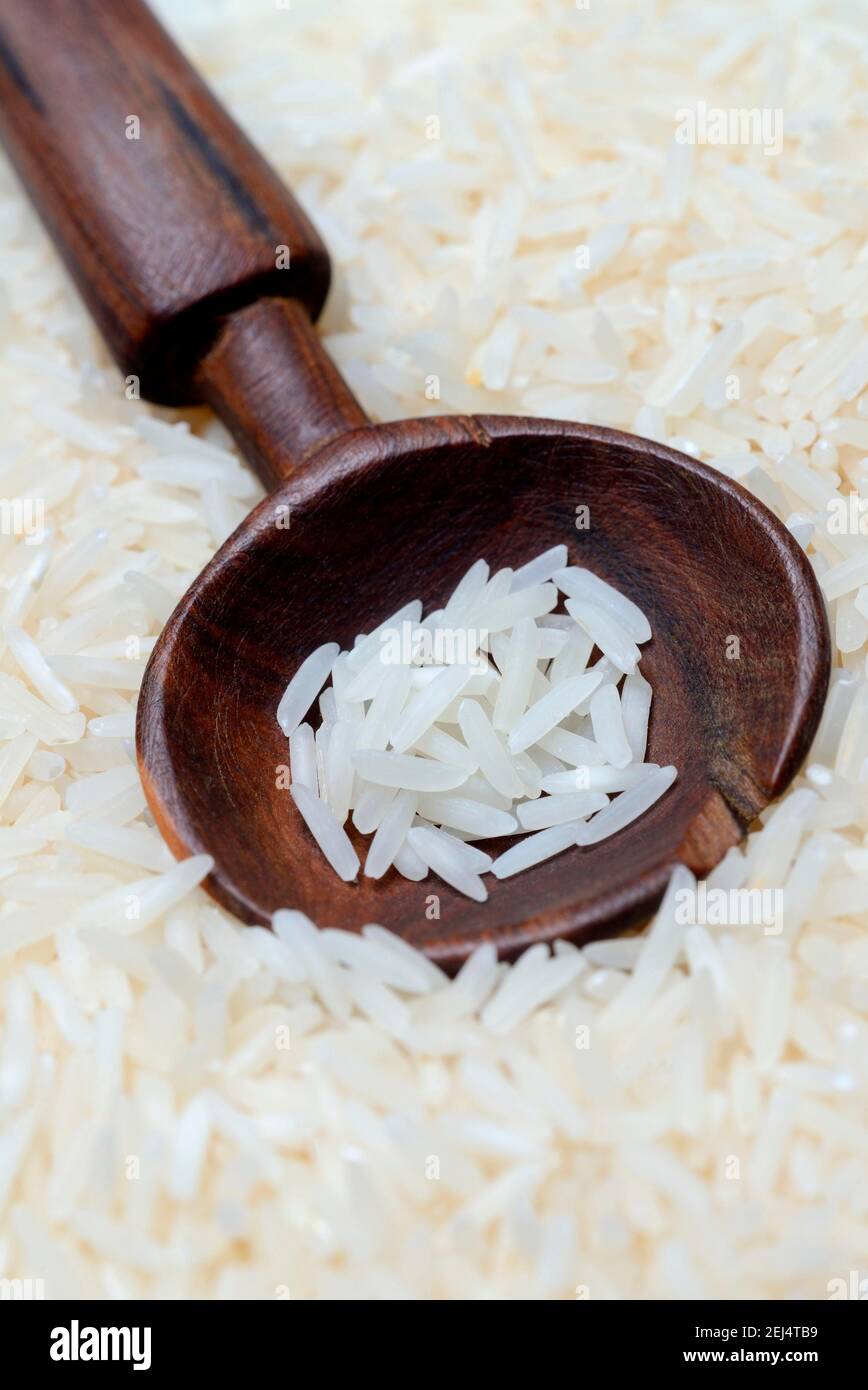 Basmati rice in wooden spoon Stock Photo - Alamy